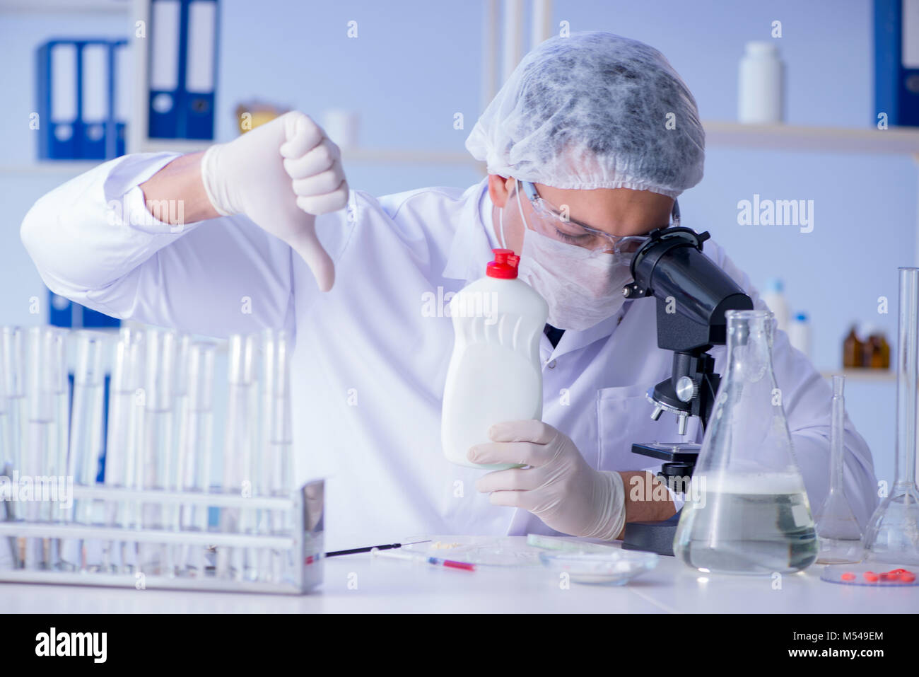 Man in the lab testing new cleaning solution detergent Stock Photo - Alamy