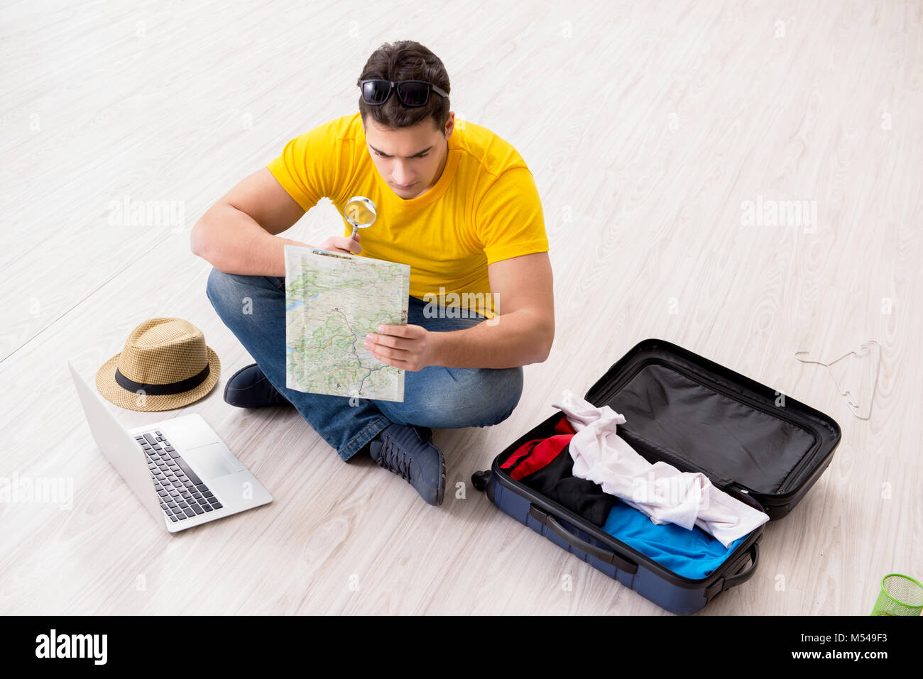 Man planning his vacation trip with map Stock Photo - Alamy
