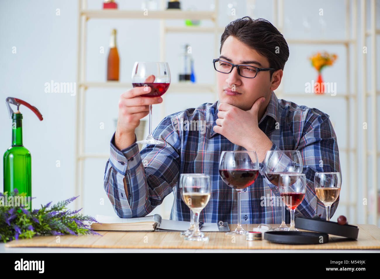 Professional sommelier tasting red wine Stock Photo - Alamy