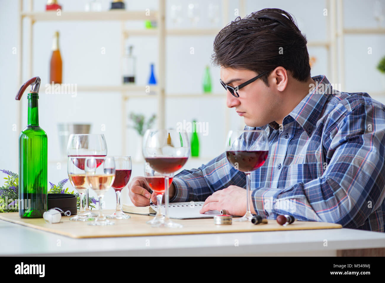Professional sommelier tasting red wine Stock Photo - Alamy