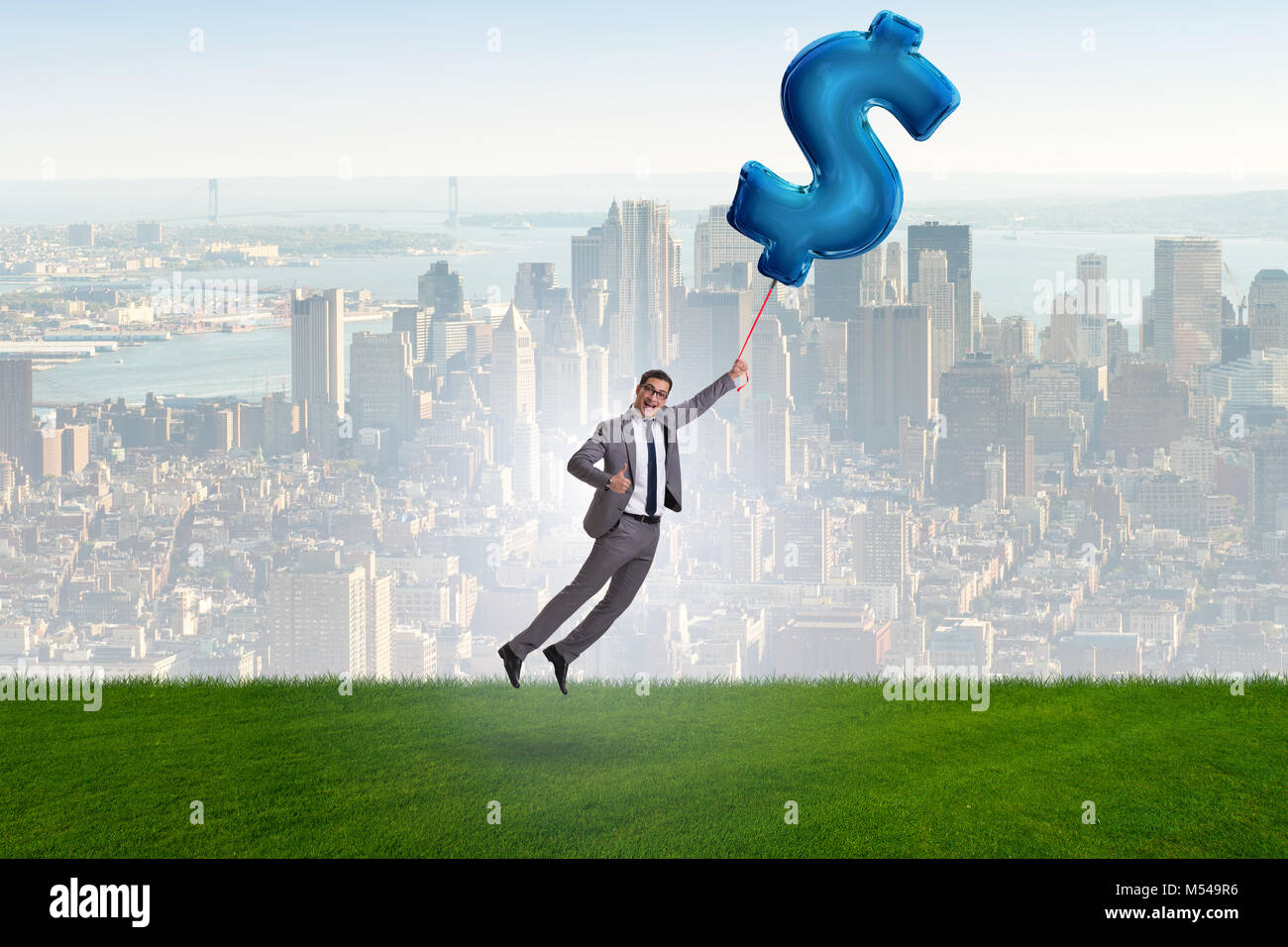 Businessman flying on dollar sign inflatable balloon Stock Photo - Alamy