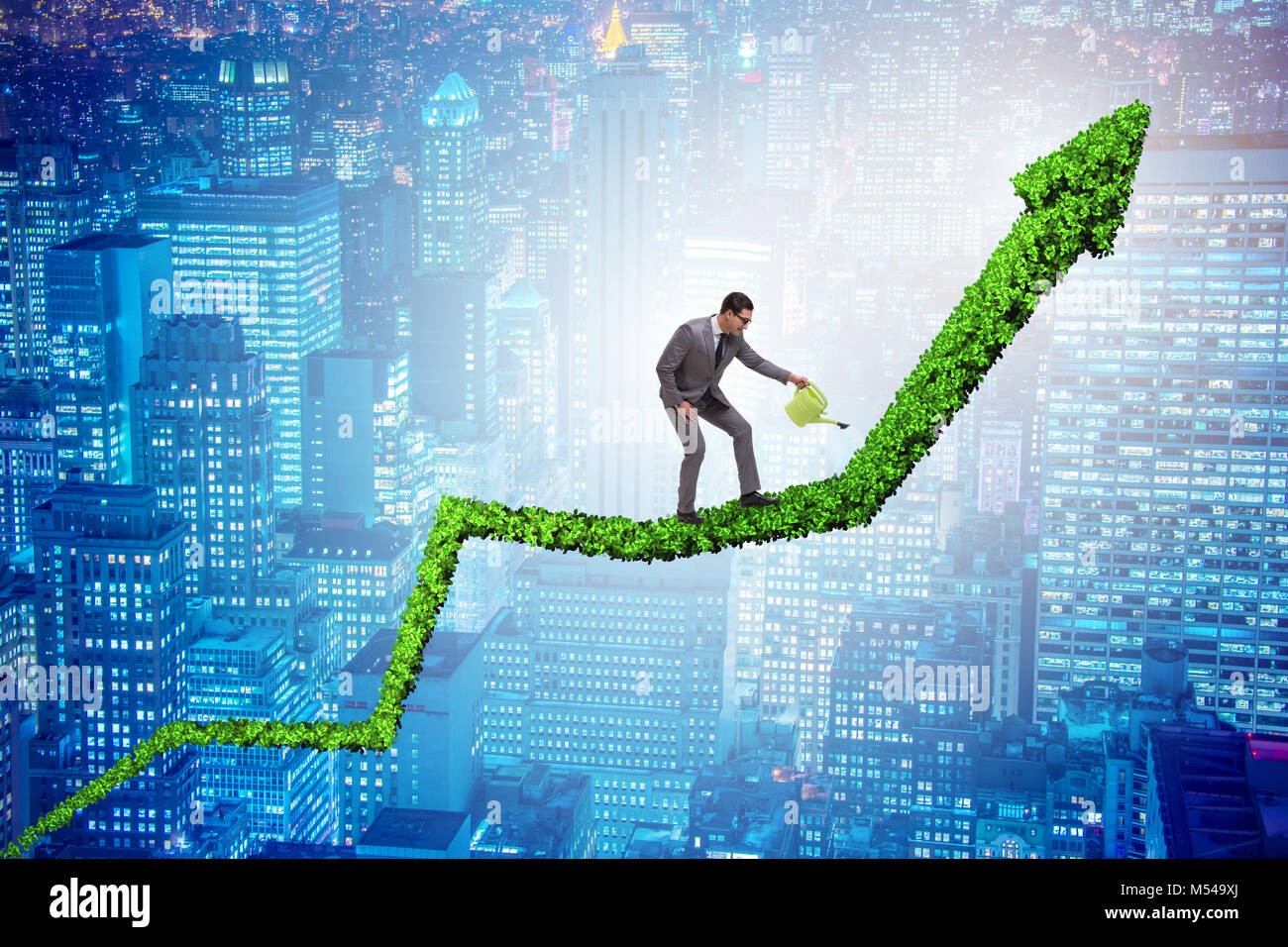 Businessman in investment concept watering financial line chart Stock ...