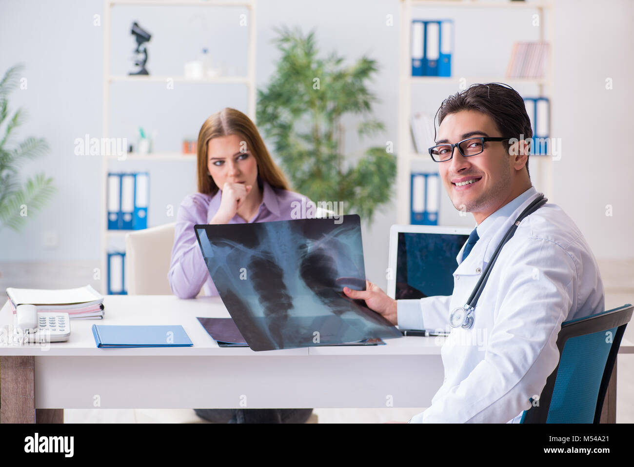Doctor examining x-ray images of patient Stock Photo - Alamy