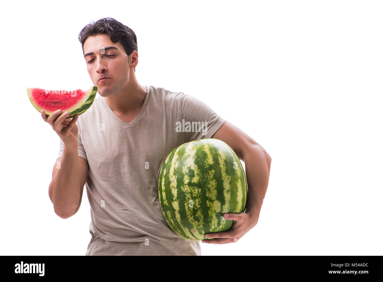 Young man with watermelon isolated on white Stock Photo - Alamy