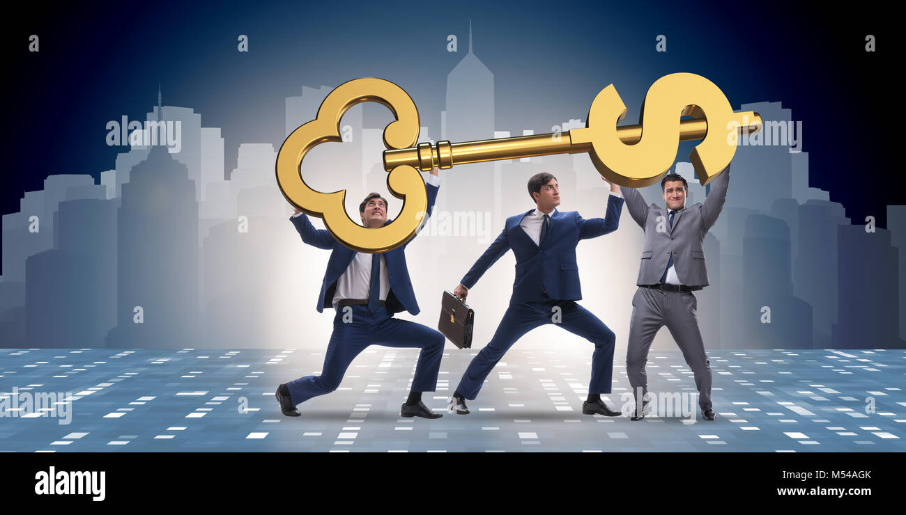 Businessmen holding giant key in finance concept Stock Photo - Alamy
