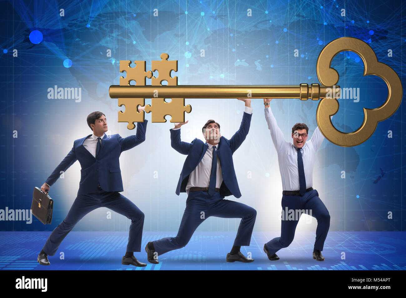 Businessmen holding giant key in business concept Stock Photo - Alamy