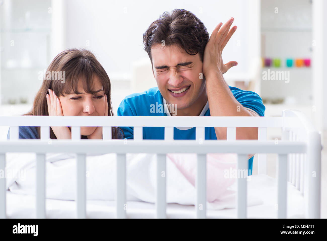 Young family frustrated at baby crying Stock Photo - Alamy