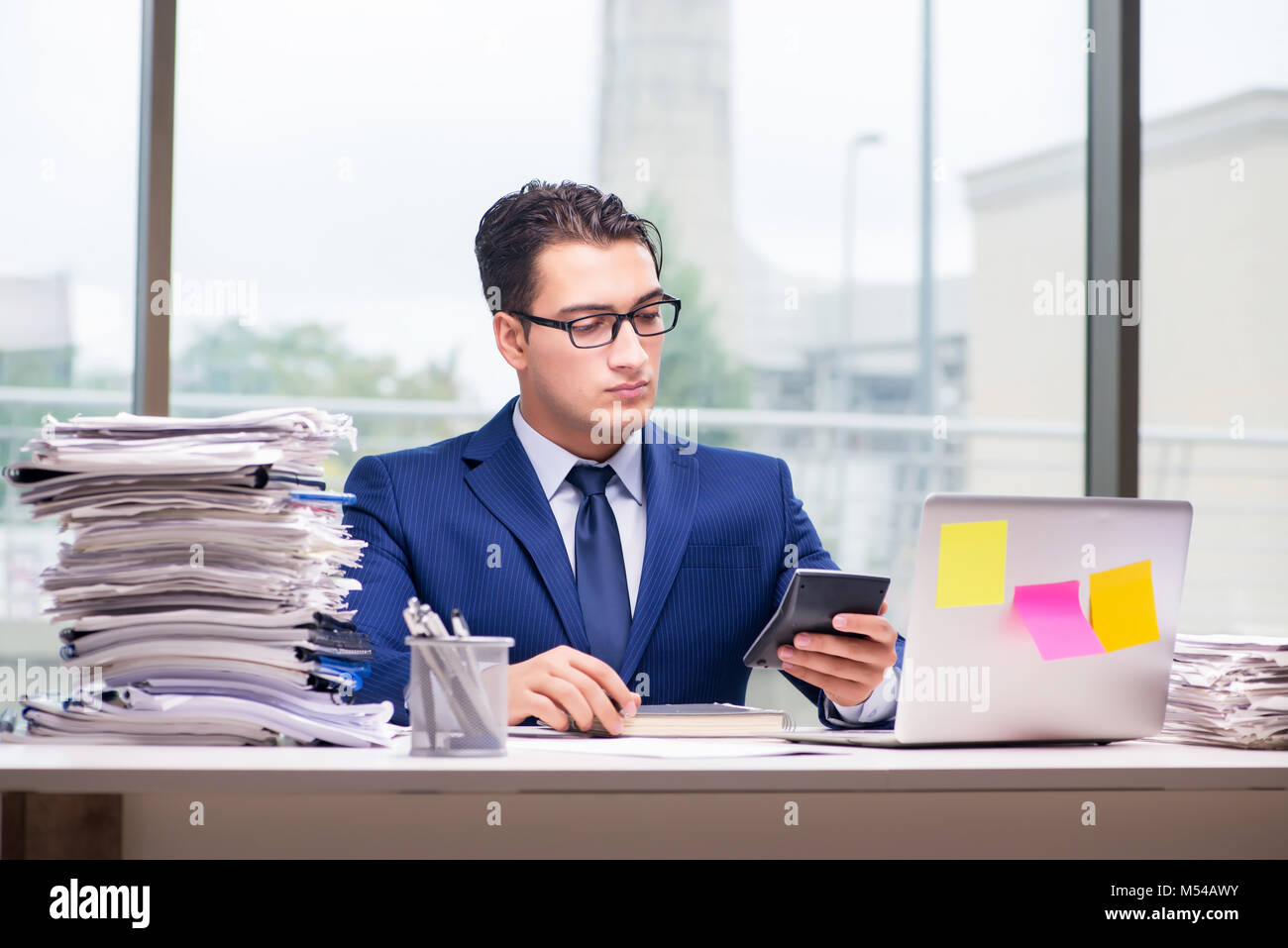 Workaholic businessman overworked with too much work in office Stock ...