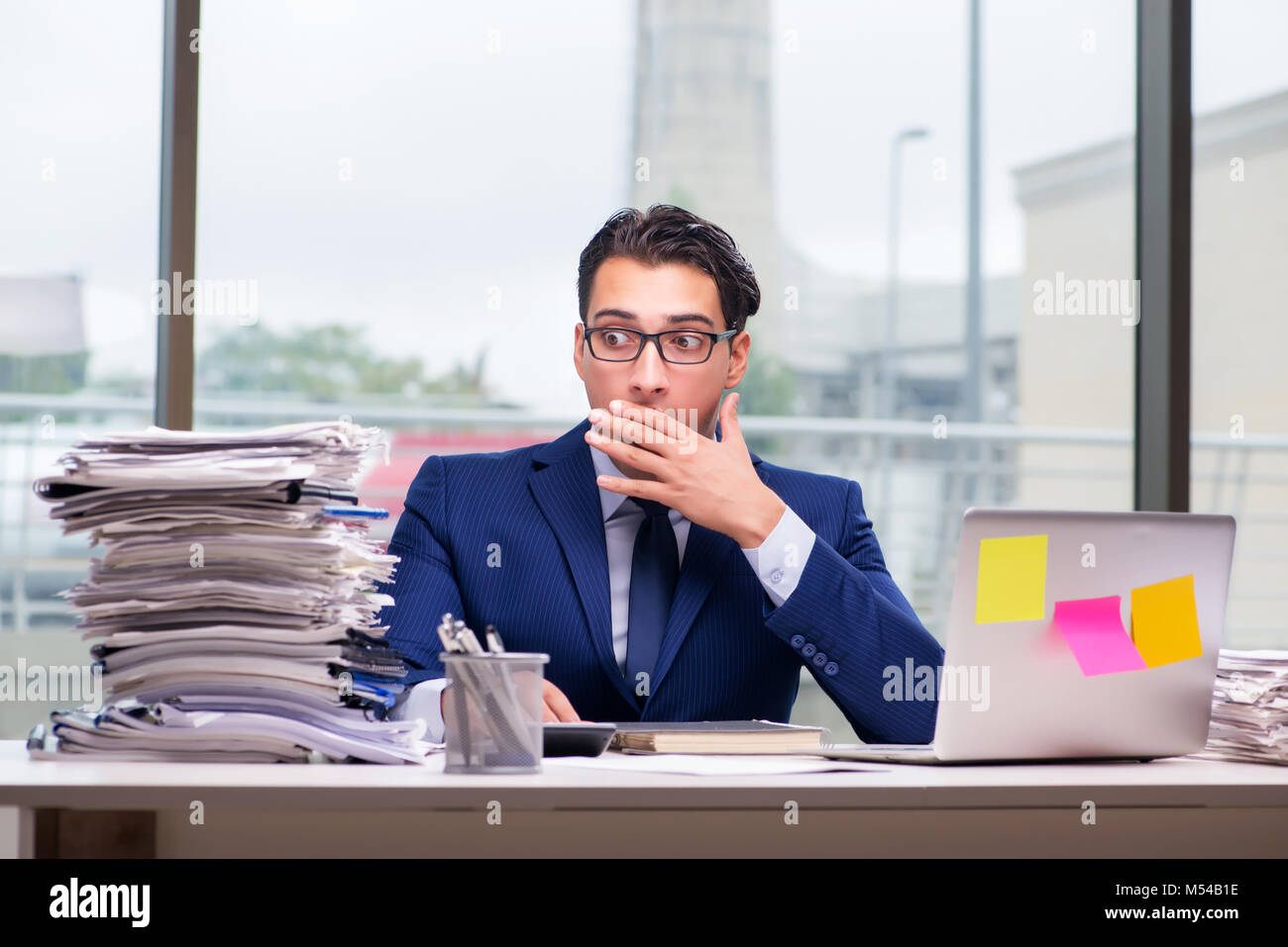 Workaholic businessman overworked with too much work in office Stock ...