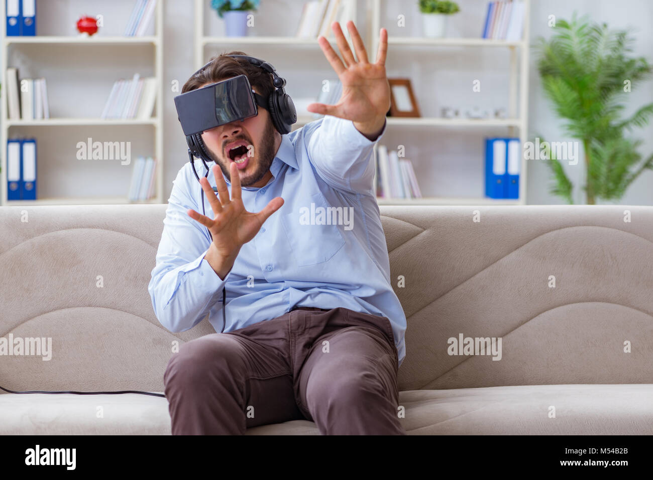 Student gamer playing games at home Stock Photo - Alamy