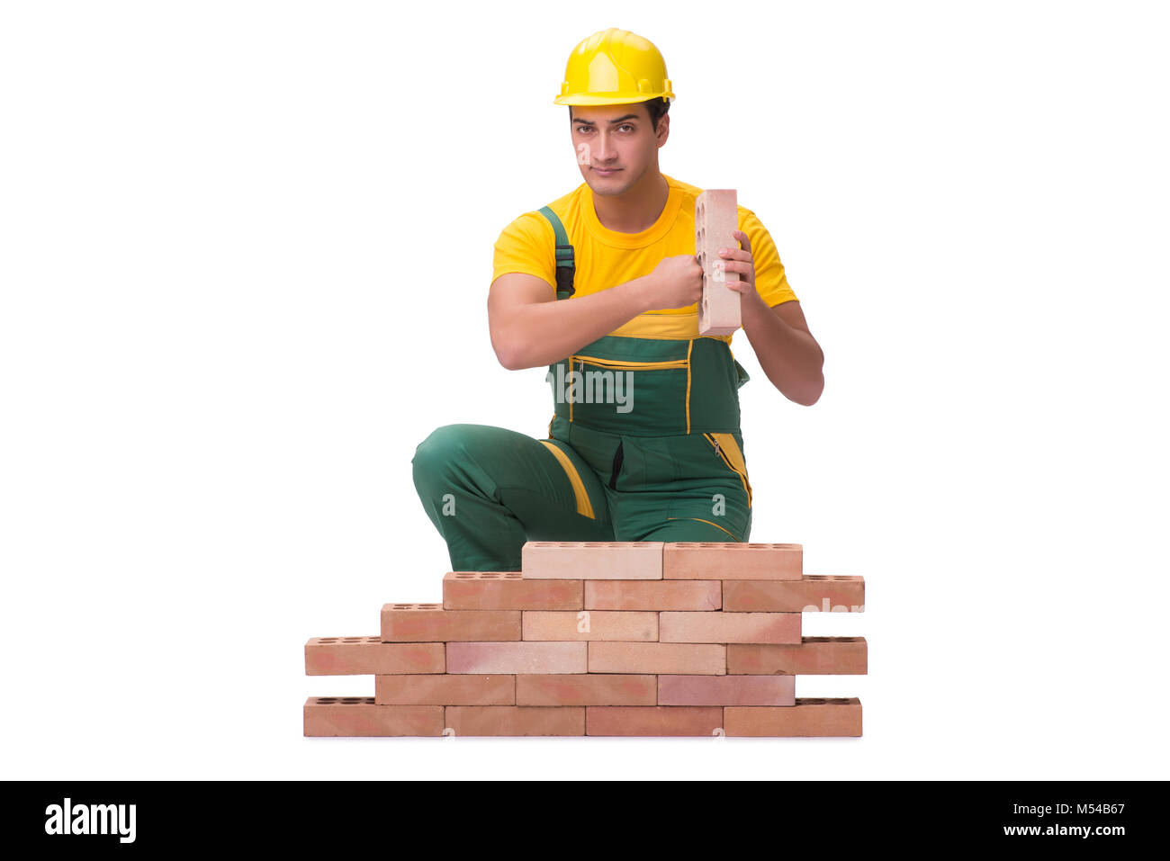 The handsome construction worker building brick wall Stock Photo - Alamy