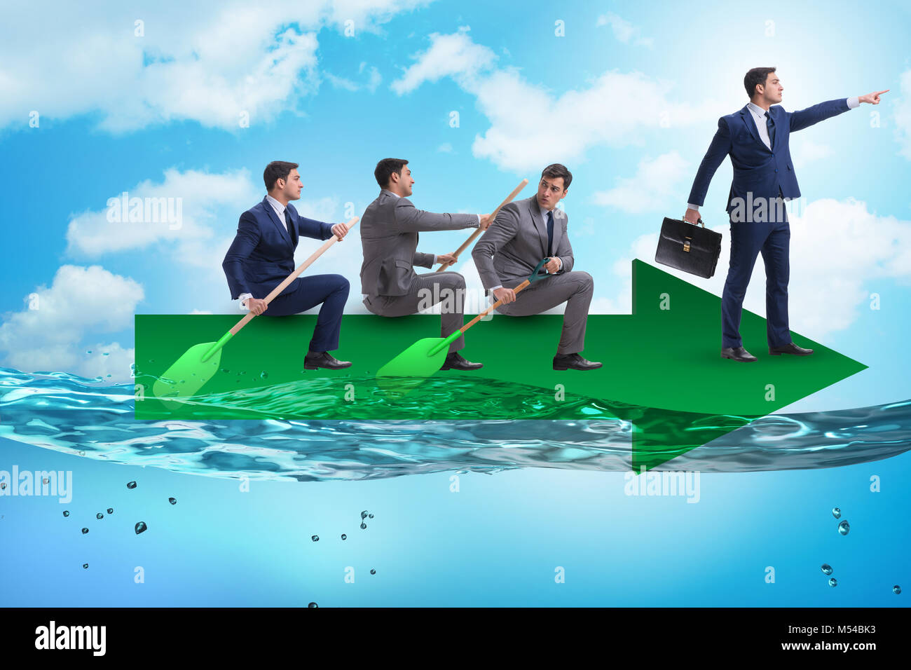 Teamwork concept with businessmen on boat Stock Photo - Alamy