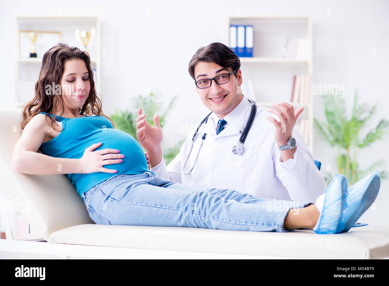 Doctor examining pregnant female patient in hospital Stock Photo - Alamy