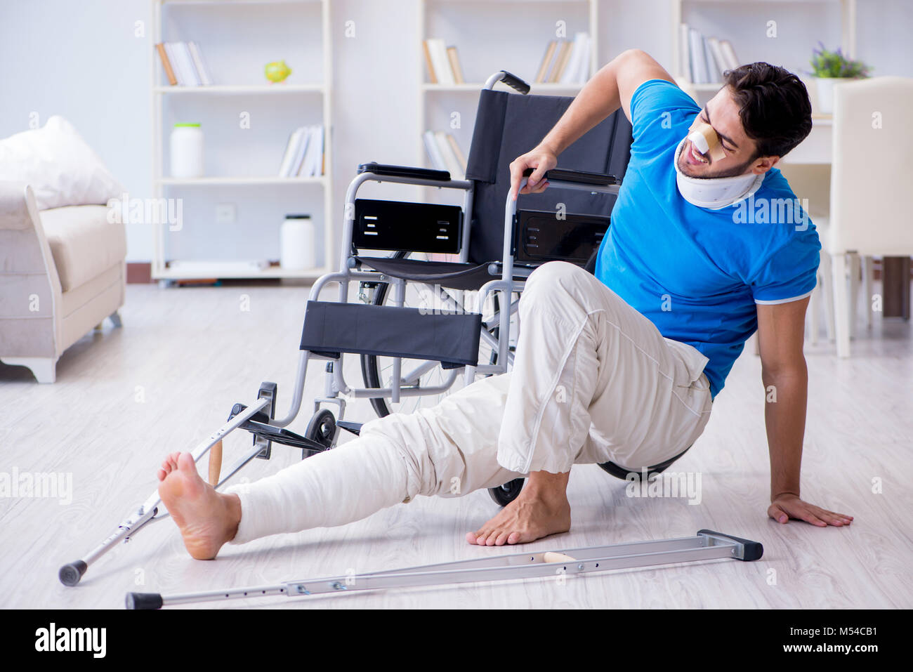 Injured young man recovering at home Stock Photo - Alamy