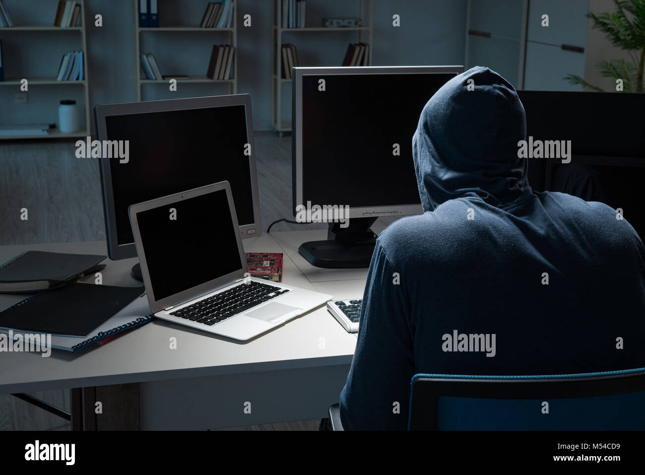Hacker hacking computer at night Stock Photo - Alamy