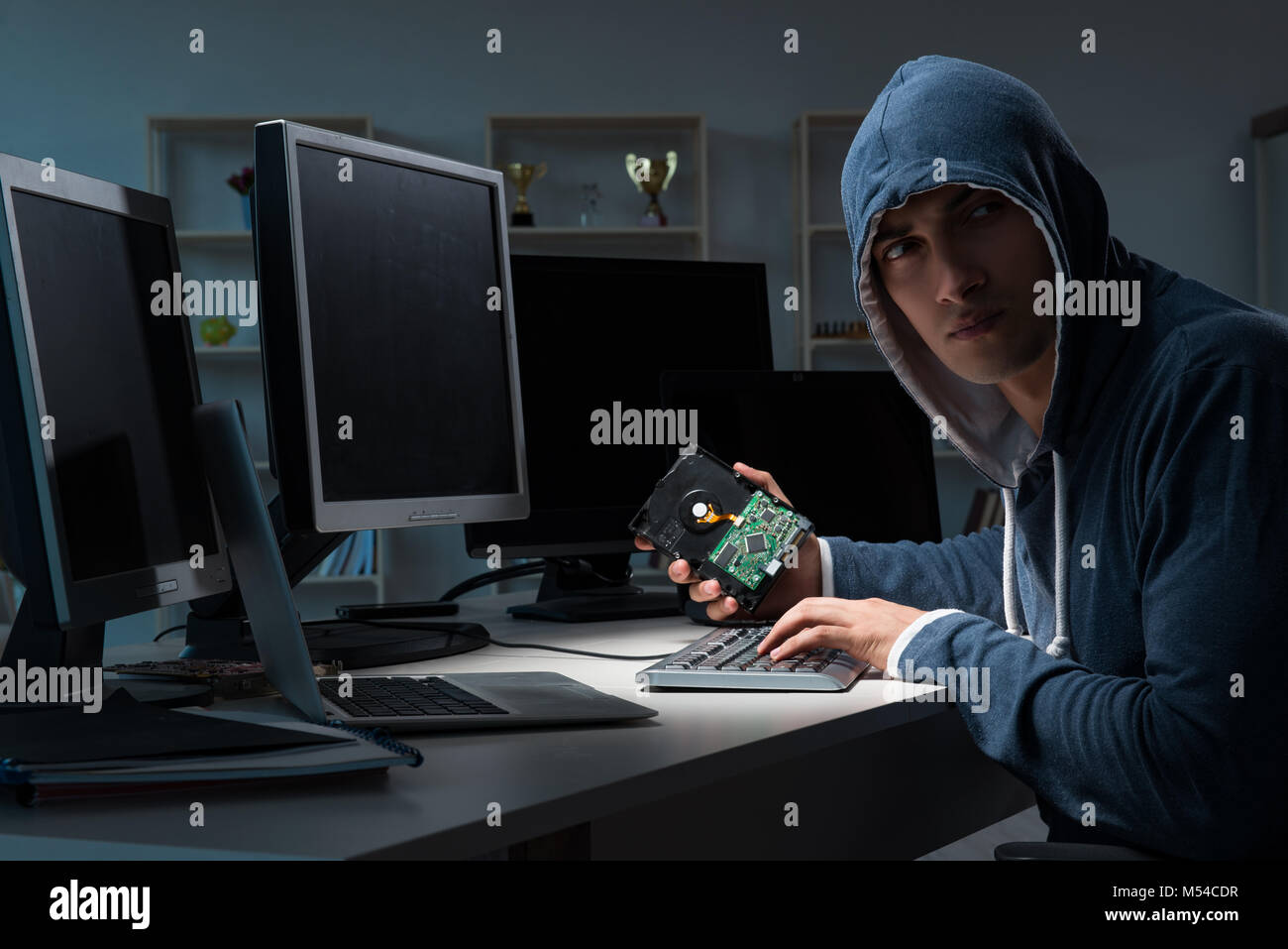 Hacker hacking computer at night Stock Photo - Alamy
