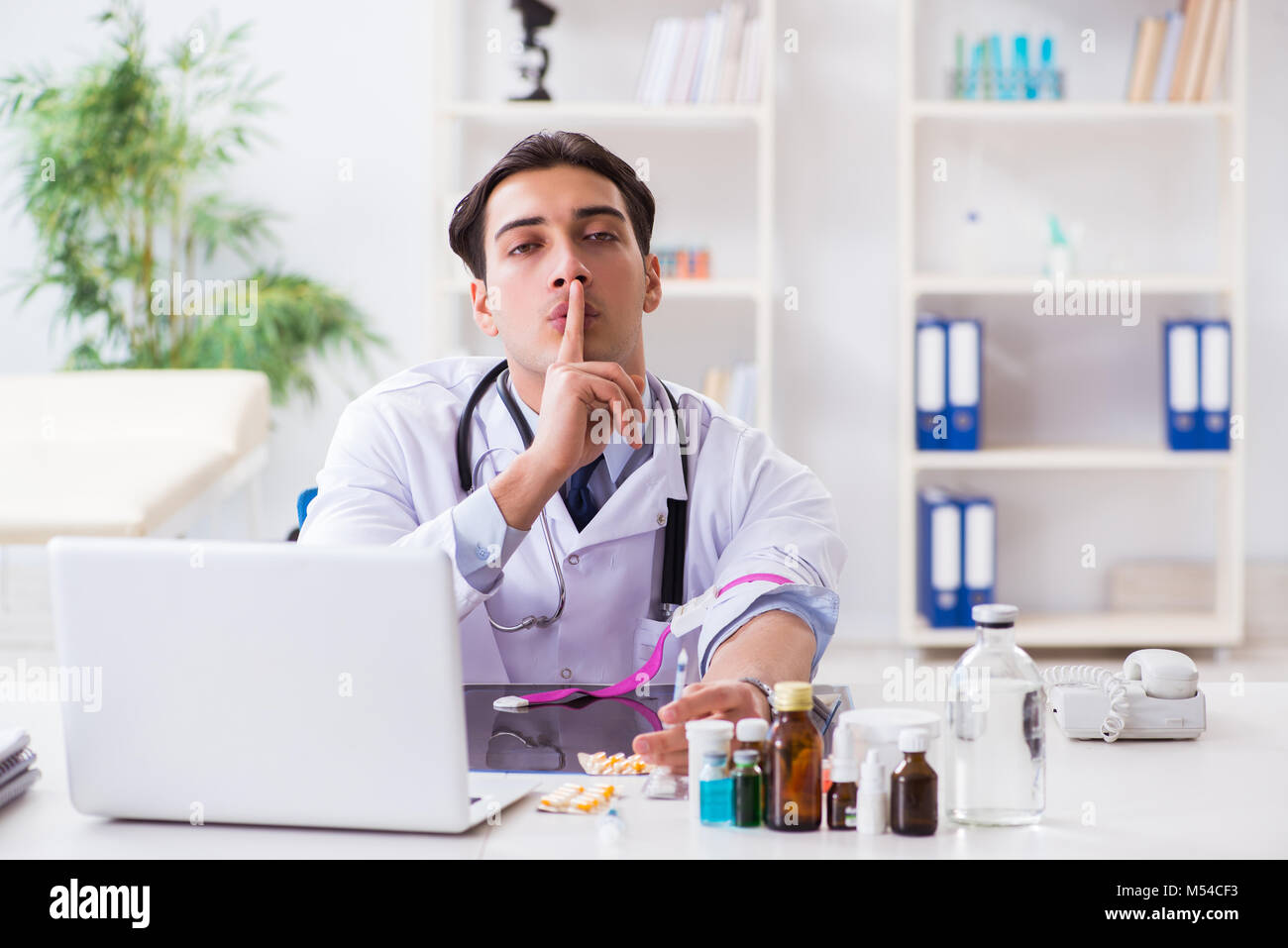 Doctor drug addict in the hospital Stock Photo - Alamy