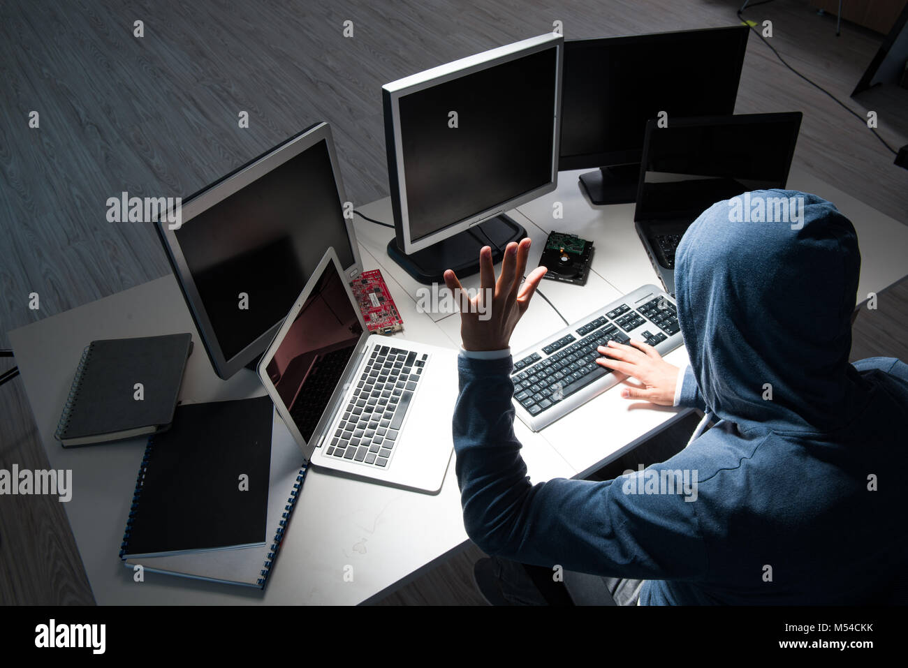 Hacker hacking computer at night Stock Photo - Alamy