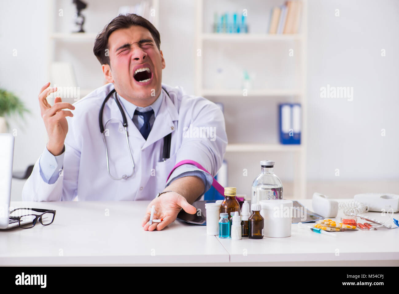 Doctor drug addict in the hospital Stock Photo - Alamy