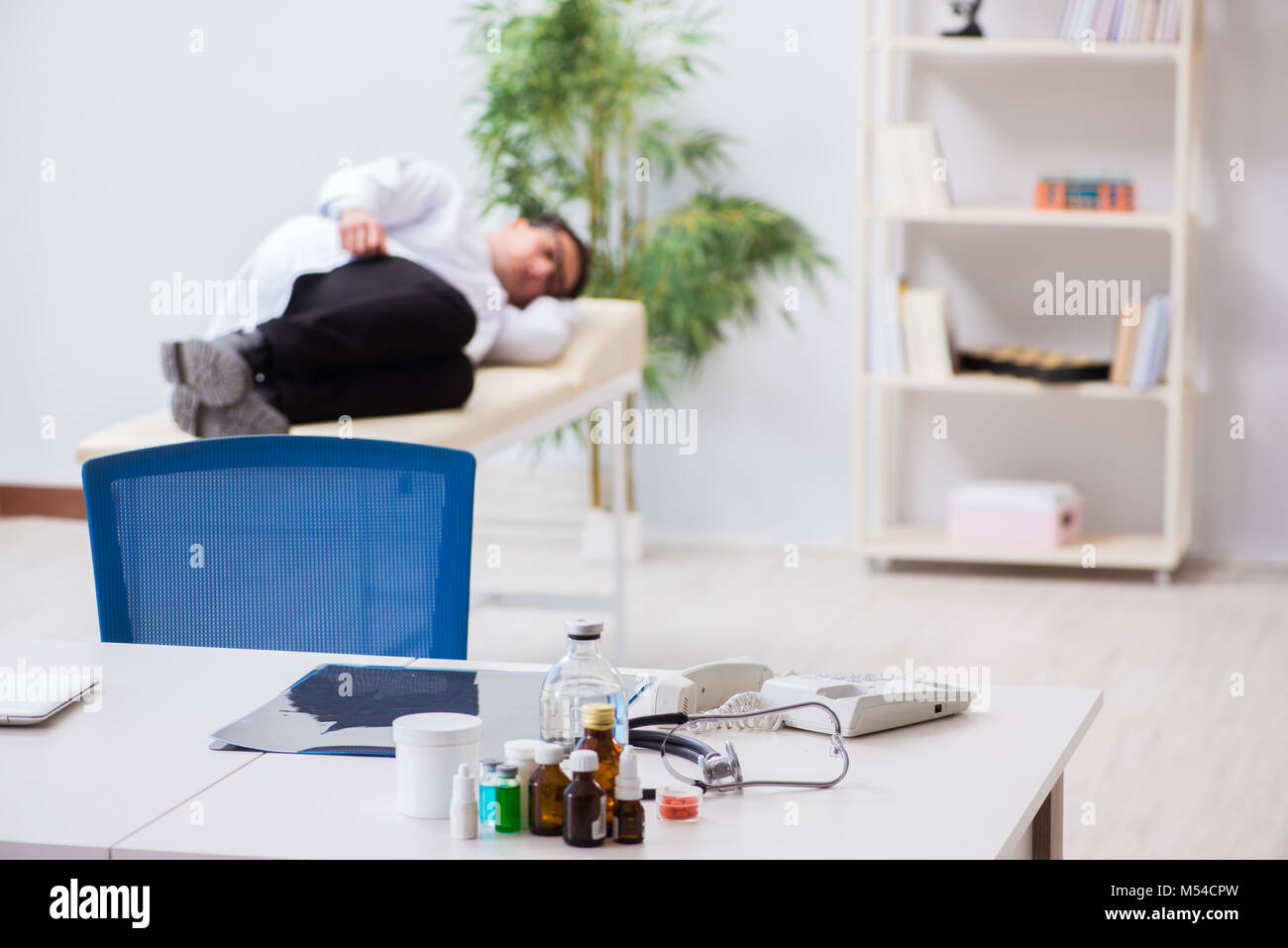 Doctor relaxing after complex surgery in hospital Stock Photo - Alamy