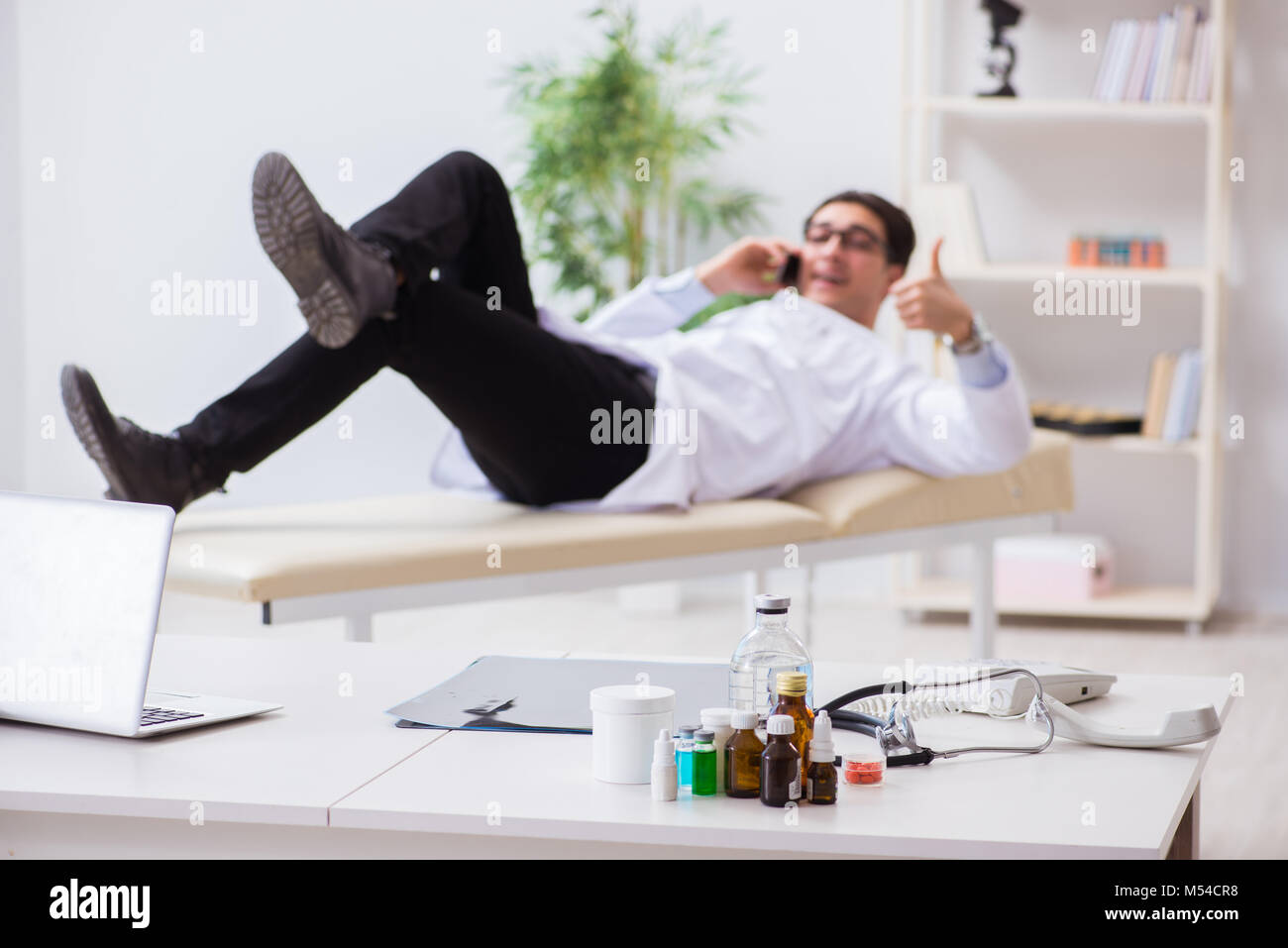 Doctor relaxing after complex surgery in hospital Stock Photo - Alamy