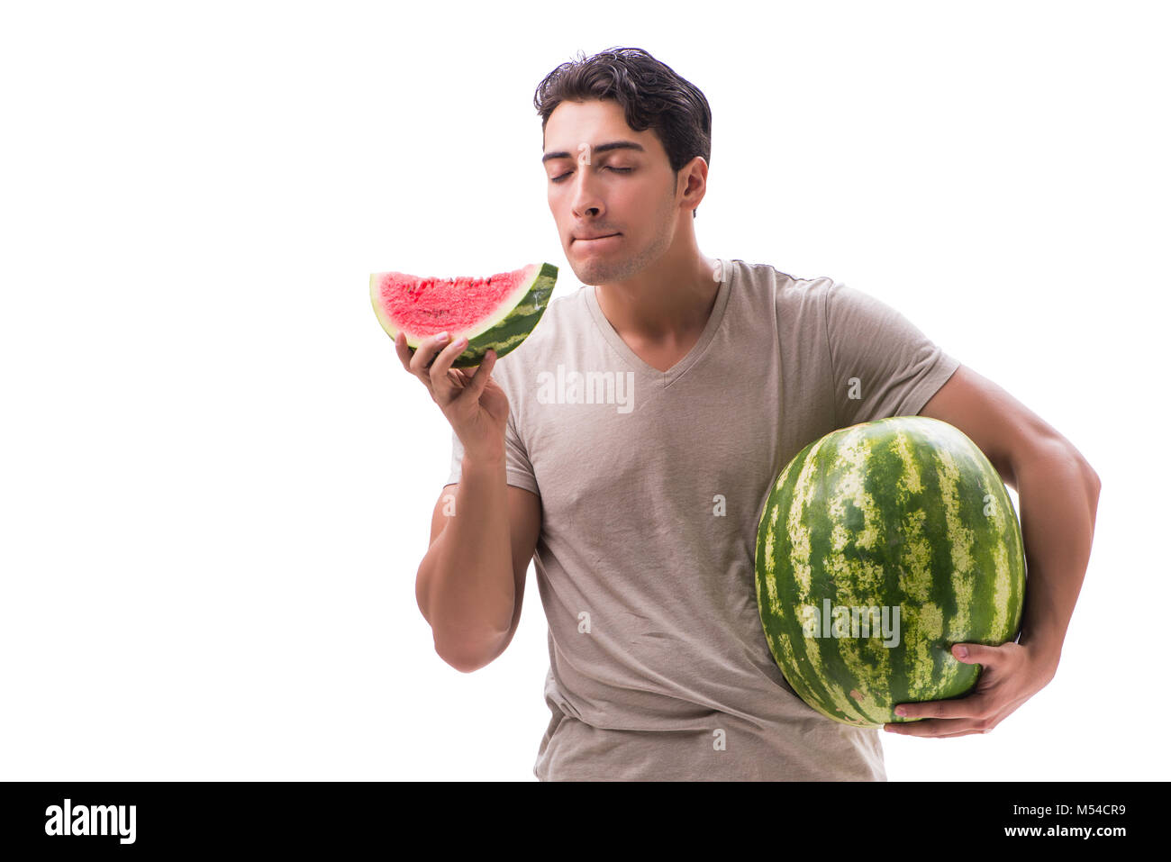 Young man with watermelon isolated on white Stock Photo - Alamy
