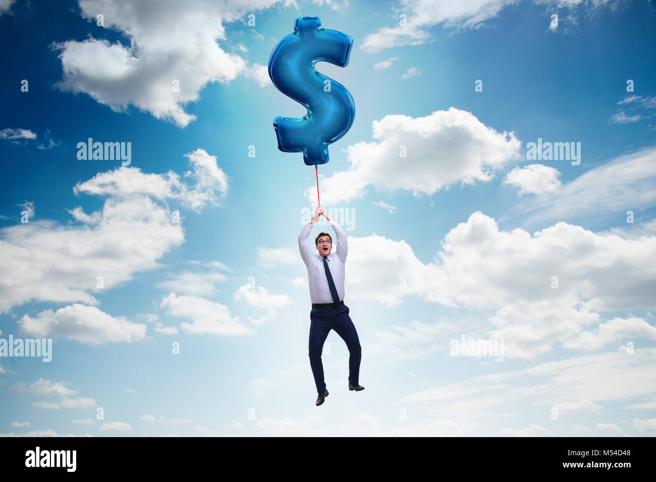 Businessman flying on dollar sign inflatable balloon Stock Photo - Alamy
