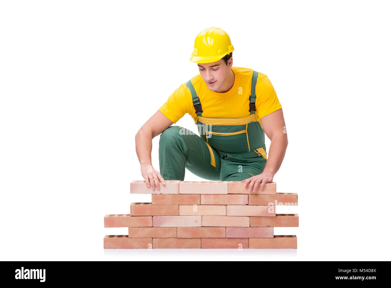 The handsome construction worker building brick wall Stock Photo - Alamy