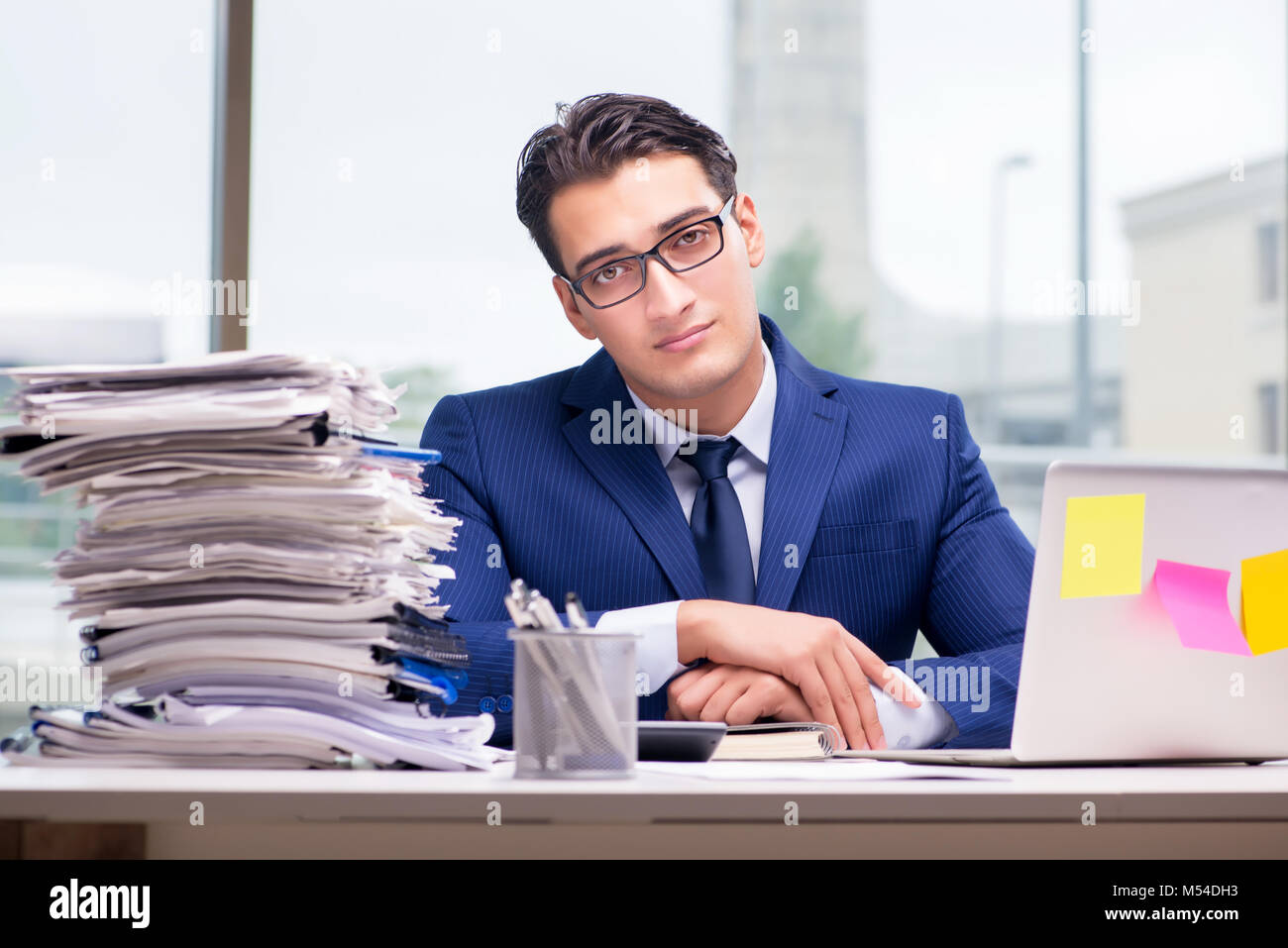 Workaholic businessman overworked with too much work in office Stock ...