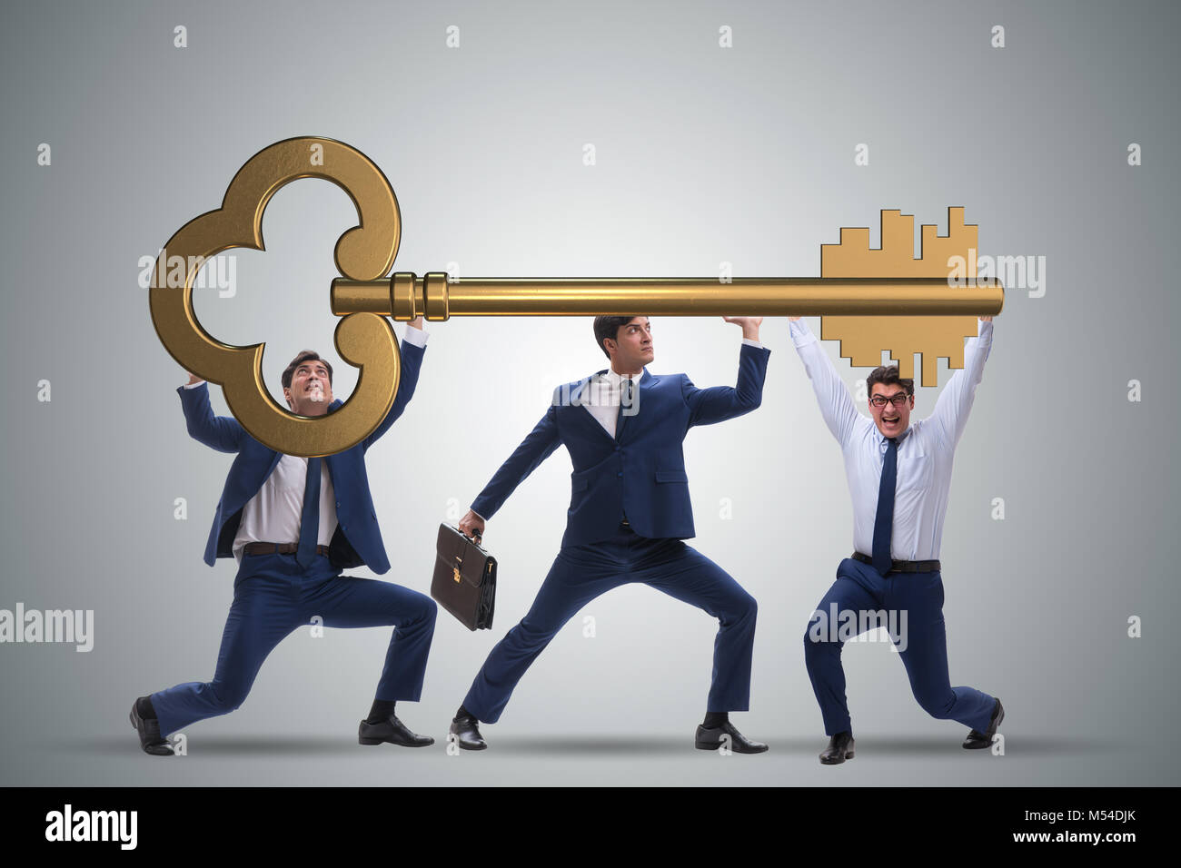 Businessmen holding giant key in business concept Stock Photo - Alamy