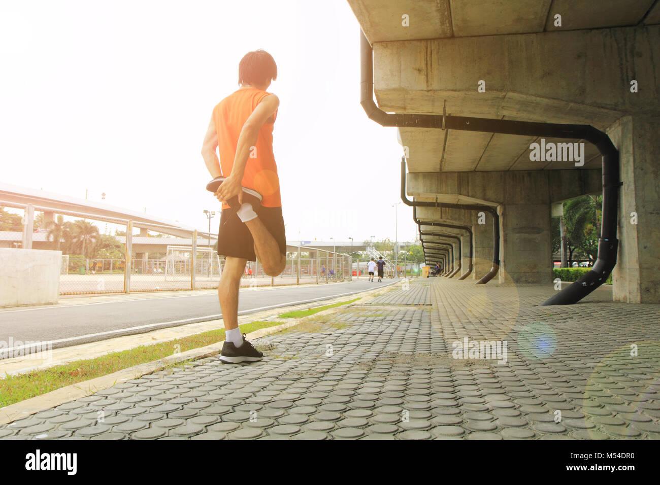The man Stretching for running Stock Photo - Alamy