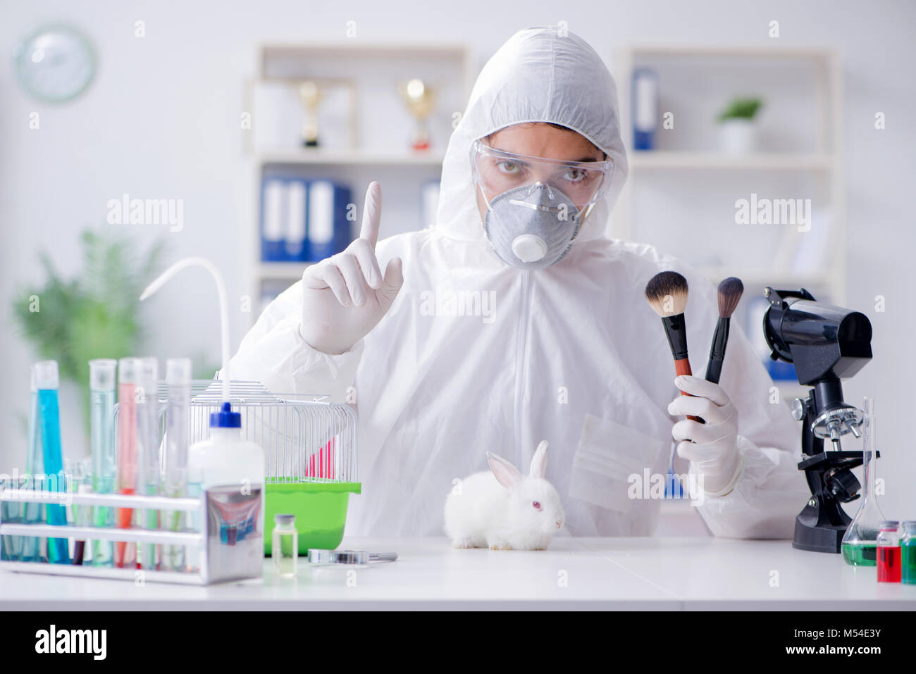 Scientist doing animal experiment in lab with rabbit Stock Photo - Alamy