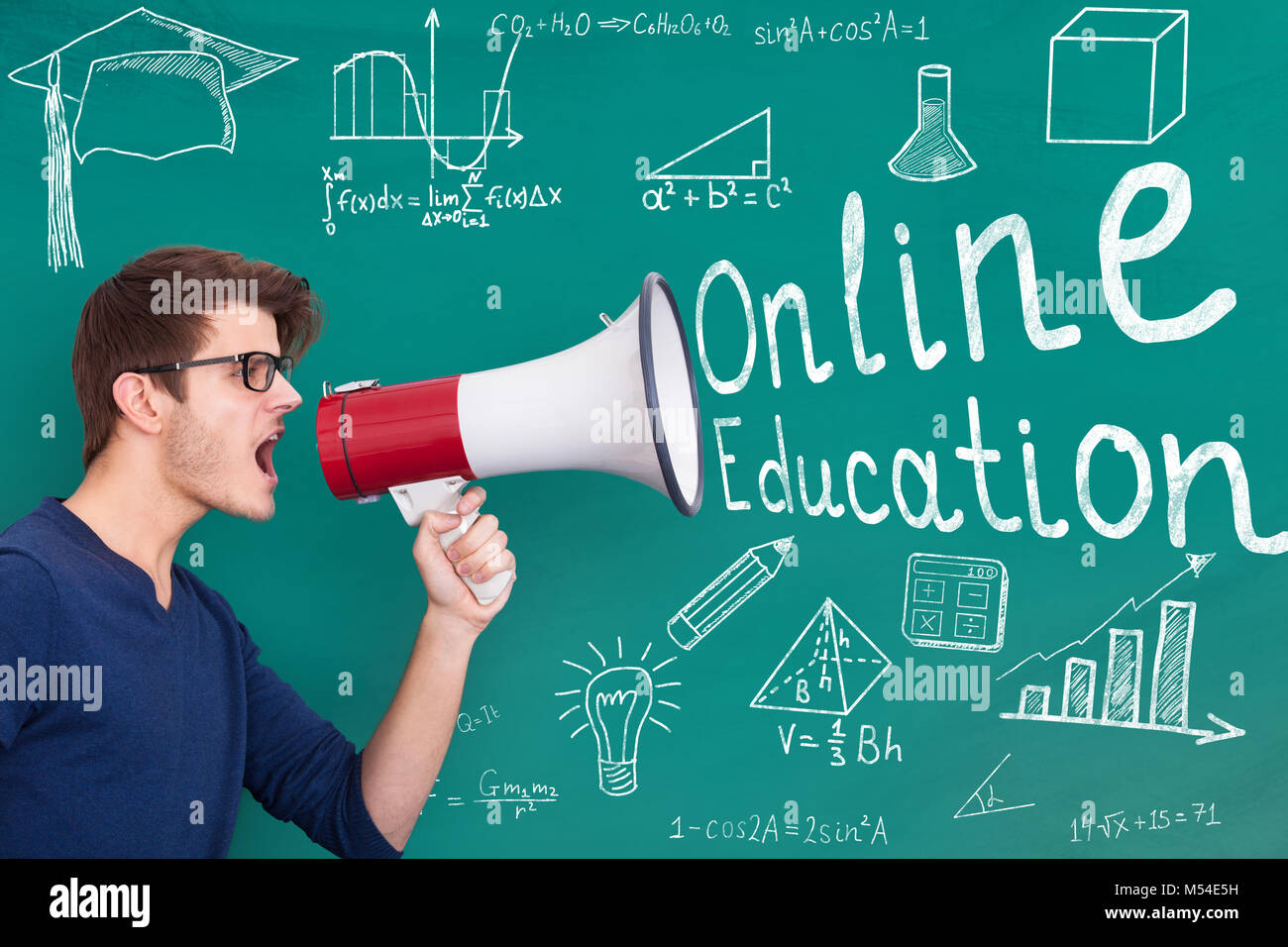 Male Teacher Announcing Online Education Through Megaphone In Classroom ...