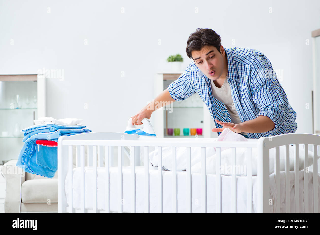 Young dad looking after newborn baby Stock Photo - Alamy