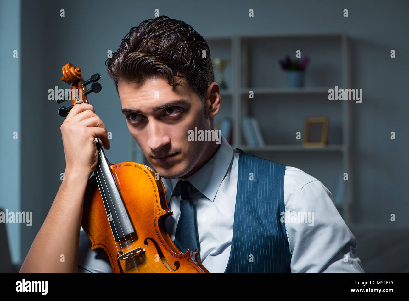Young musician man practicing playing violin at home Stock Photo - Alamy