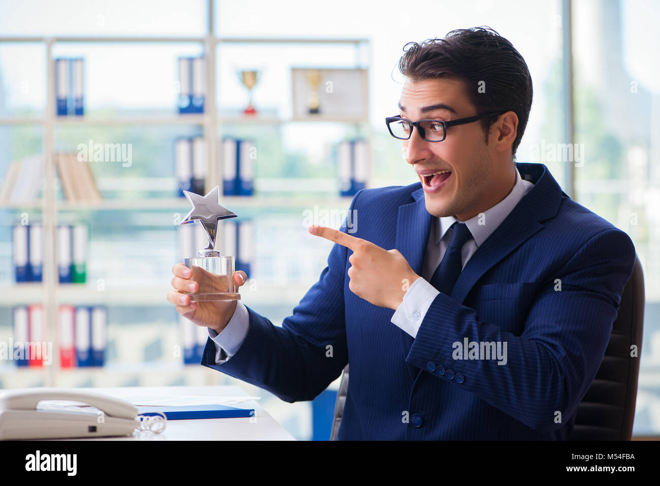 Businessman winning best employee of the month award Stock Photo - Alamy