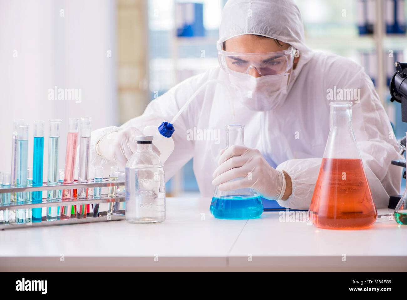 Chemist working in the laboratory with hazardous chemicals Stock Photo ...