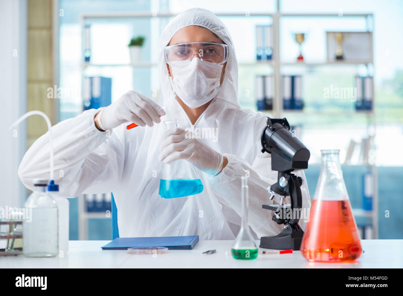 Chemist working in the laboratory with hazardous chemicals Stock Photo ...