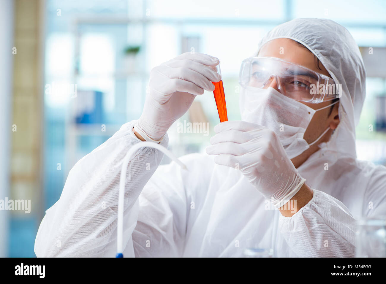 Chemist working in the laboratory with hazardous chemicals Stock Photo ...