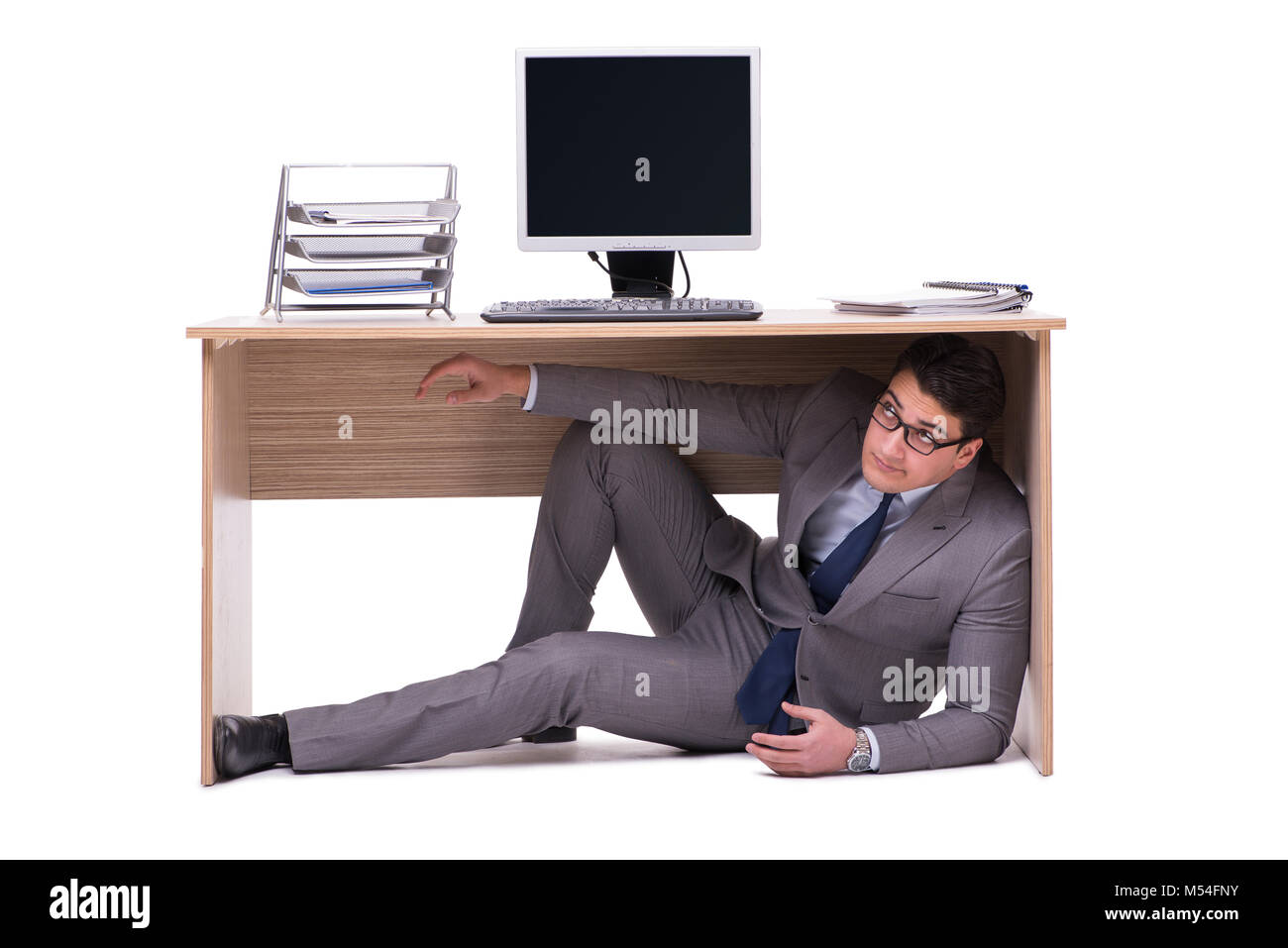 Hiding under desk Cut Out Stock Images & Pictures - Alamy