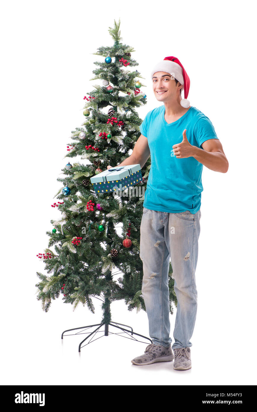 Young man decorating christmas tree isolated on white Stock Photo - Alamy