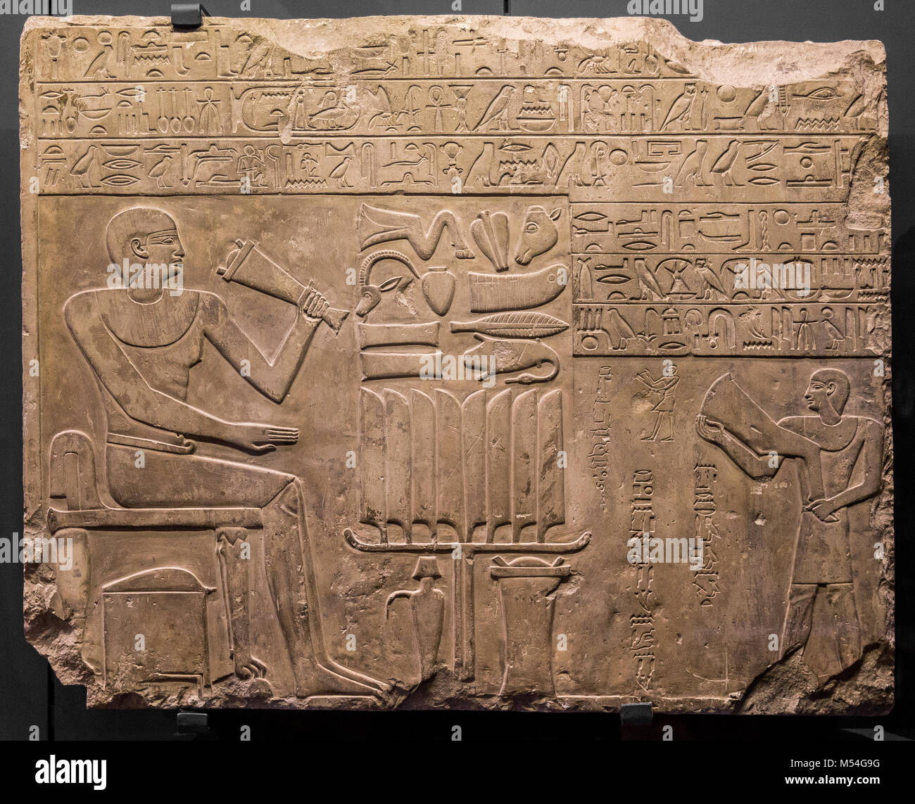 ancient stone relief at Chnum temple in Egypt Stock Photo - Alamy