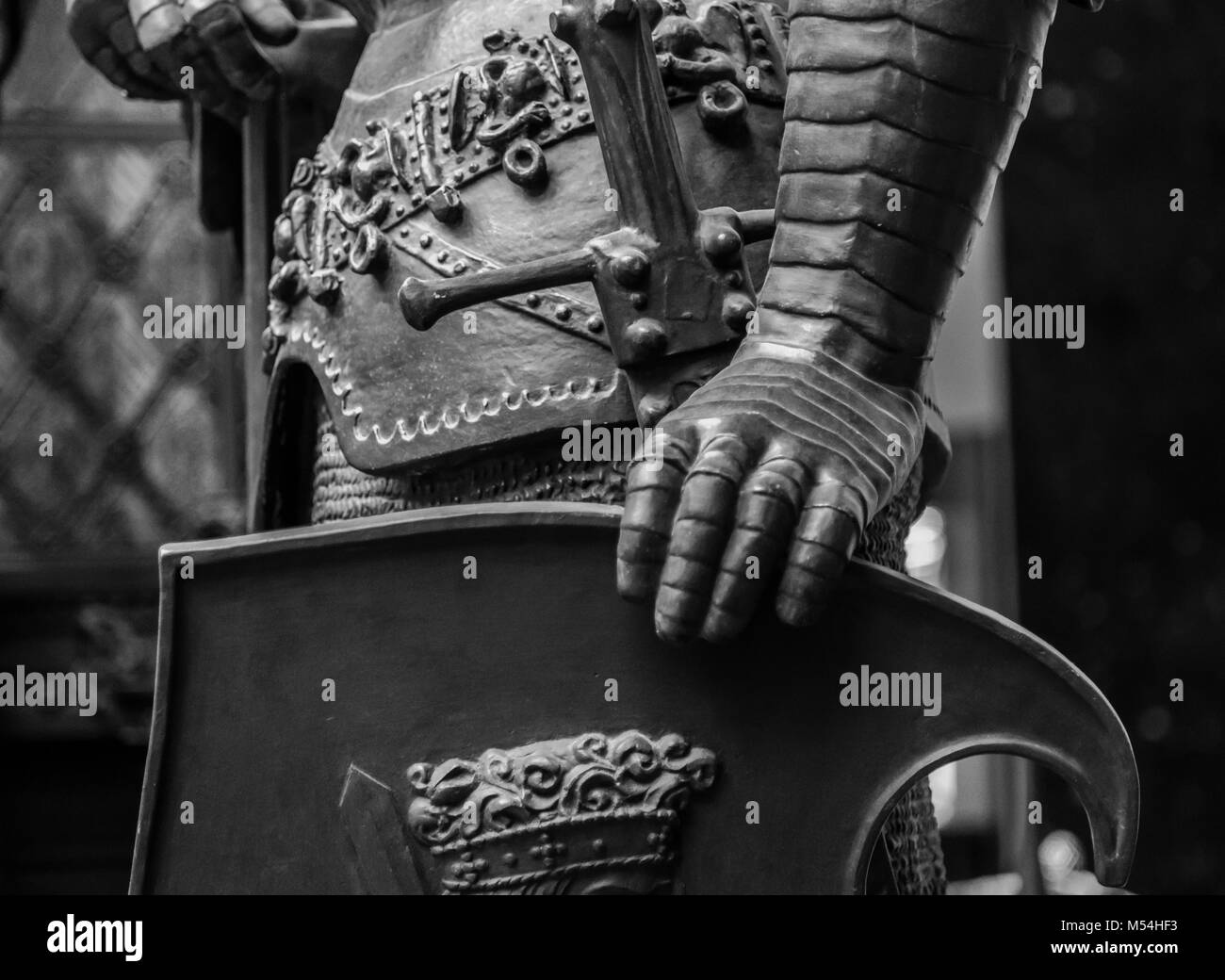 Hand in armour of the medieval knight statue Stock Photo - Alamy