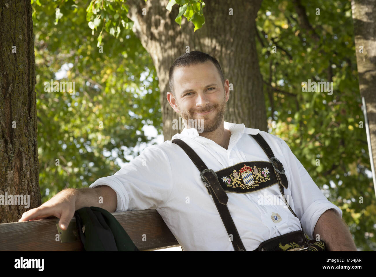 bavarian tradition man in the grass Stock Photo - Alamy