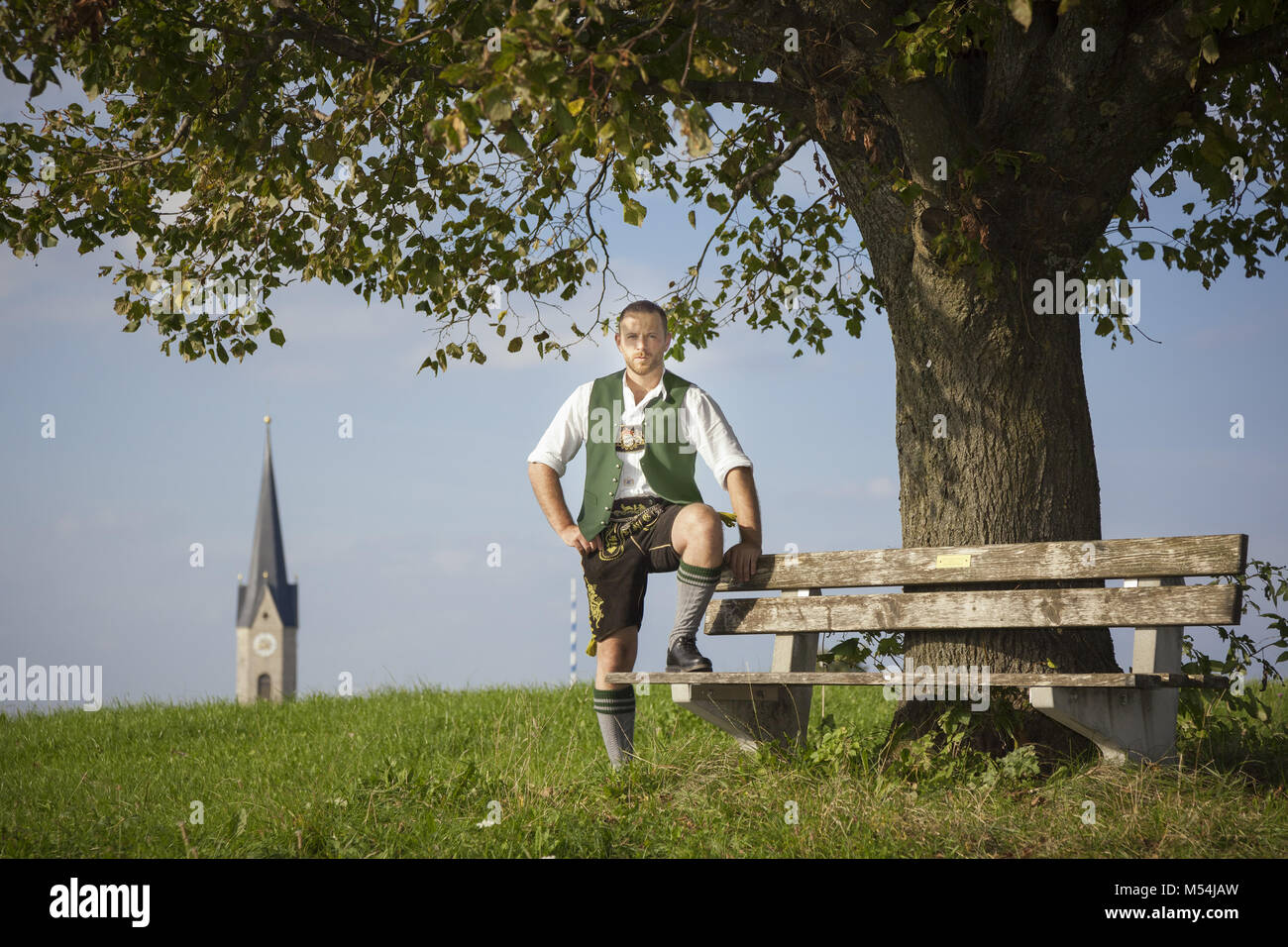 bavarian tradition man in the grass Stock Photo - Alamy