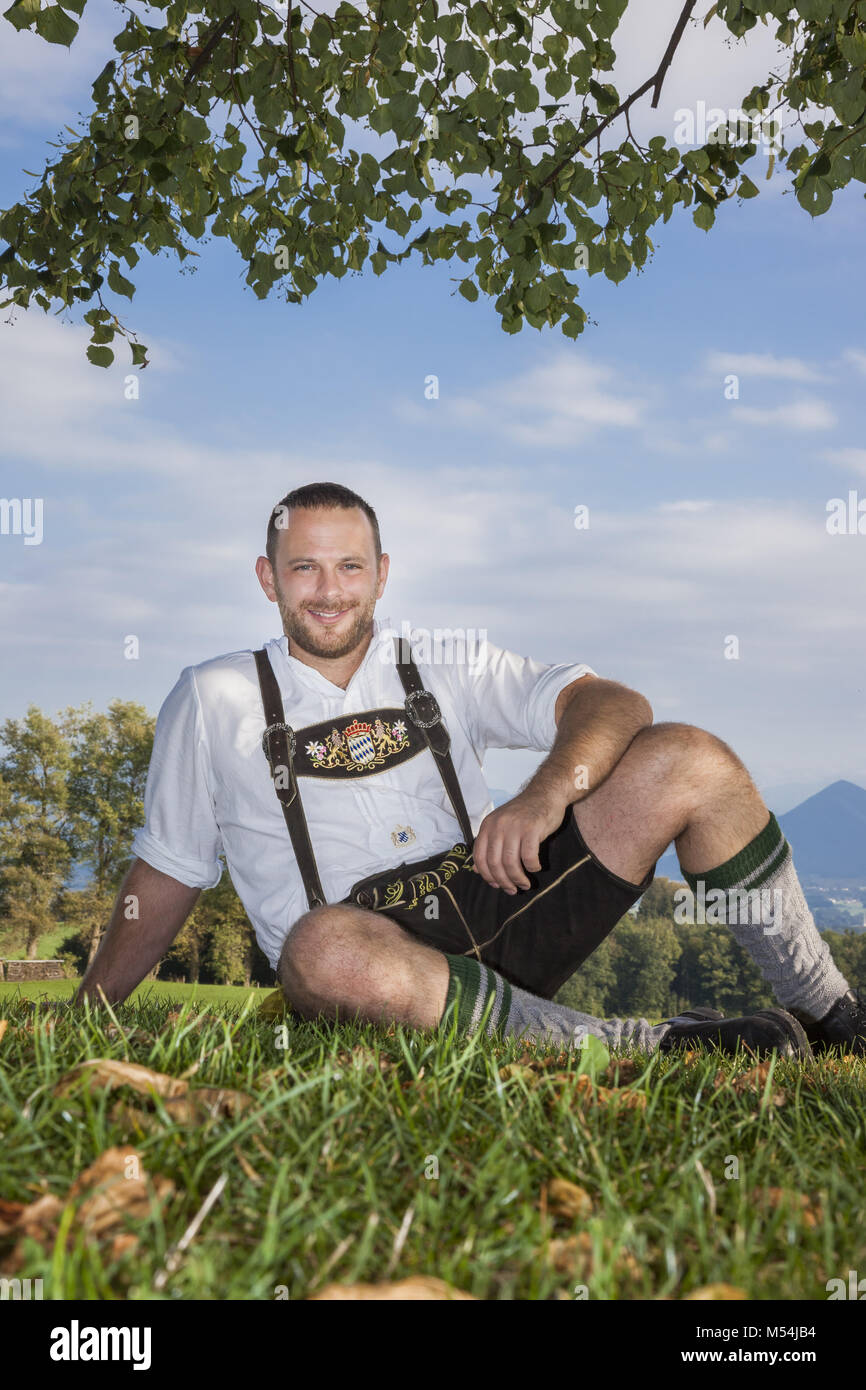 bavarian tradition man in the grass Stock Photo - Alamy