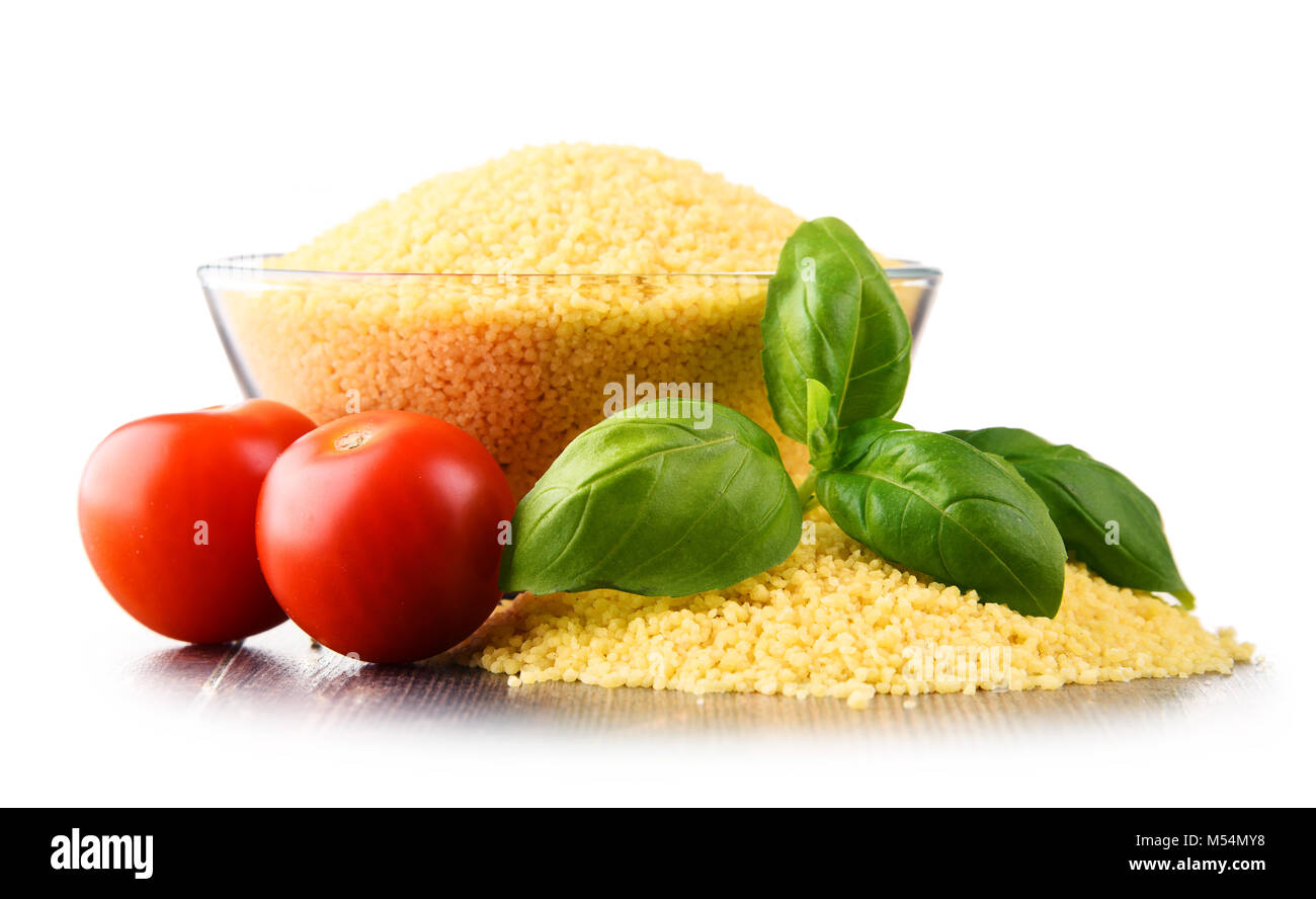 Bowl of uncooked couscous isolated on white background Stock Photo - Alamy
