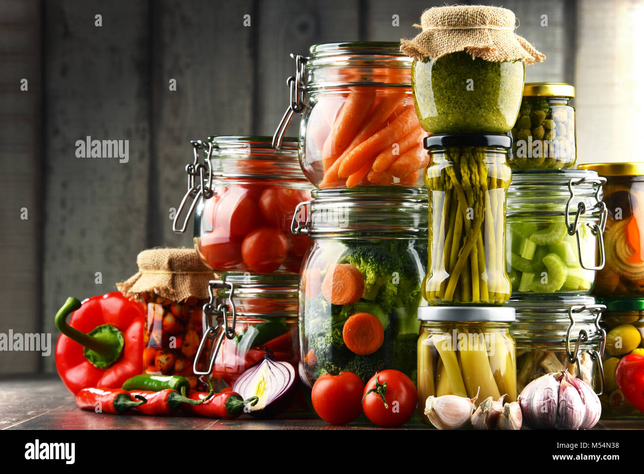 Jars with marinated food and organic raw vegetables Stock Photo - Alamy