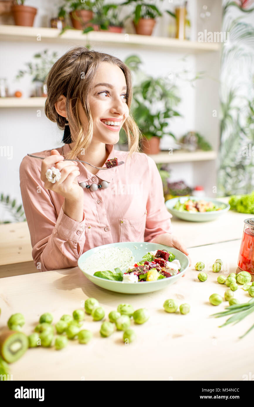 Woman eating healthy food Stock Photo - Alamy