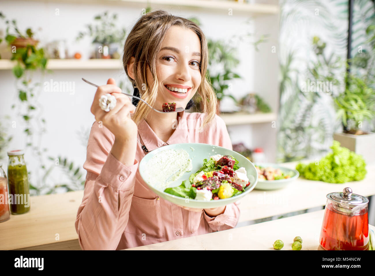 Woman eating healthy food Stock Photo - Alamy